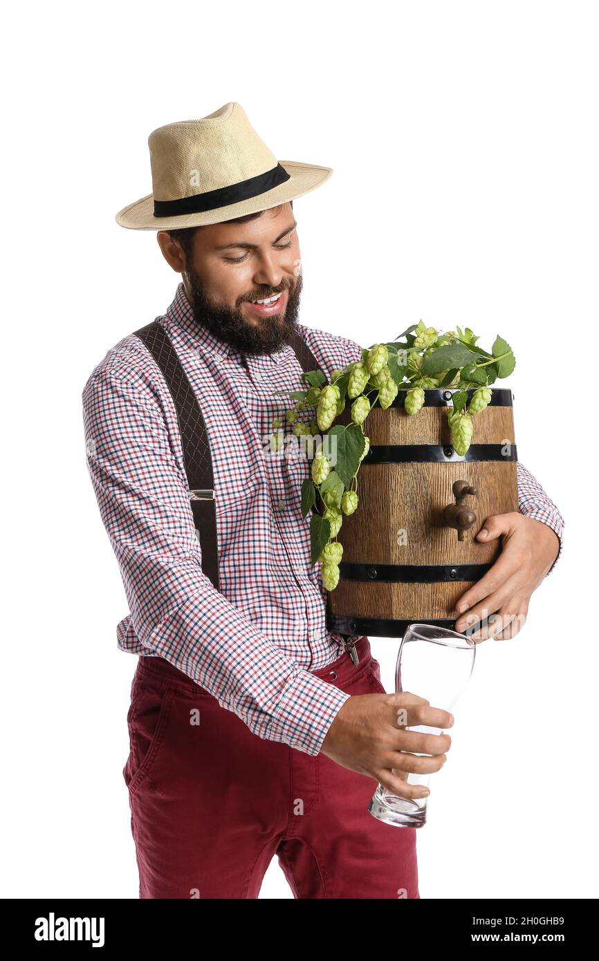 Handsome man in traditional German clothes and with beer on white ...