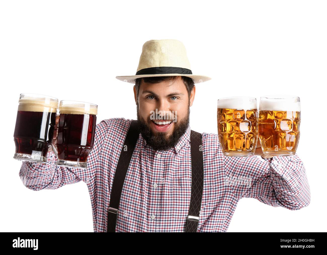 Handsome man in traditional German clothes and with beer on white ...