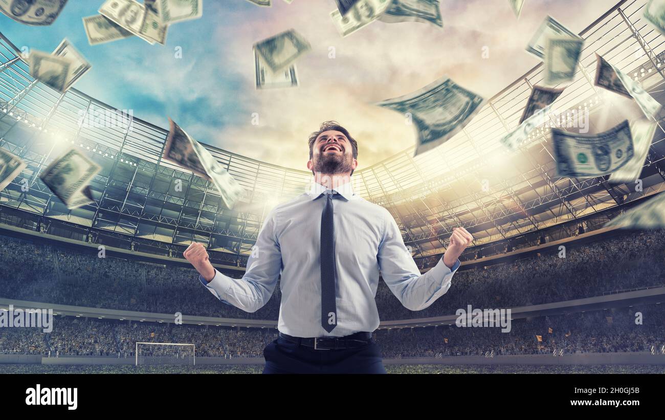 Happy man for winning a sport bet. Rain of money inside a soccer ...