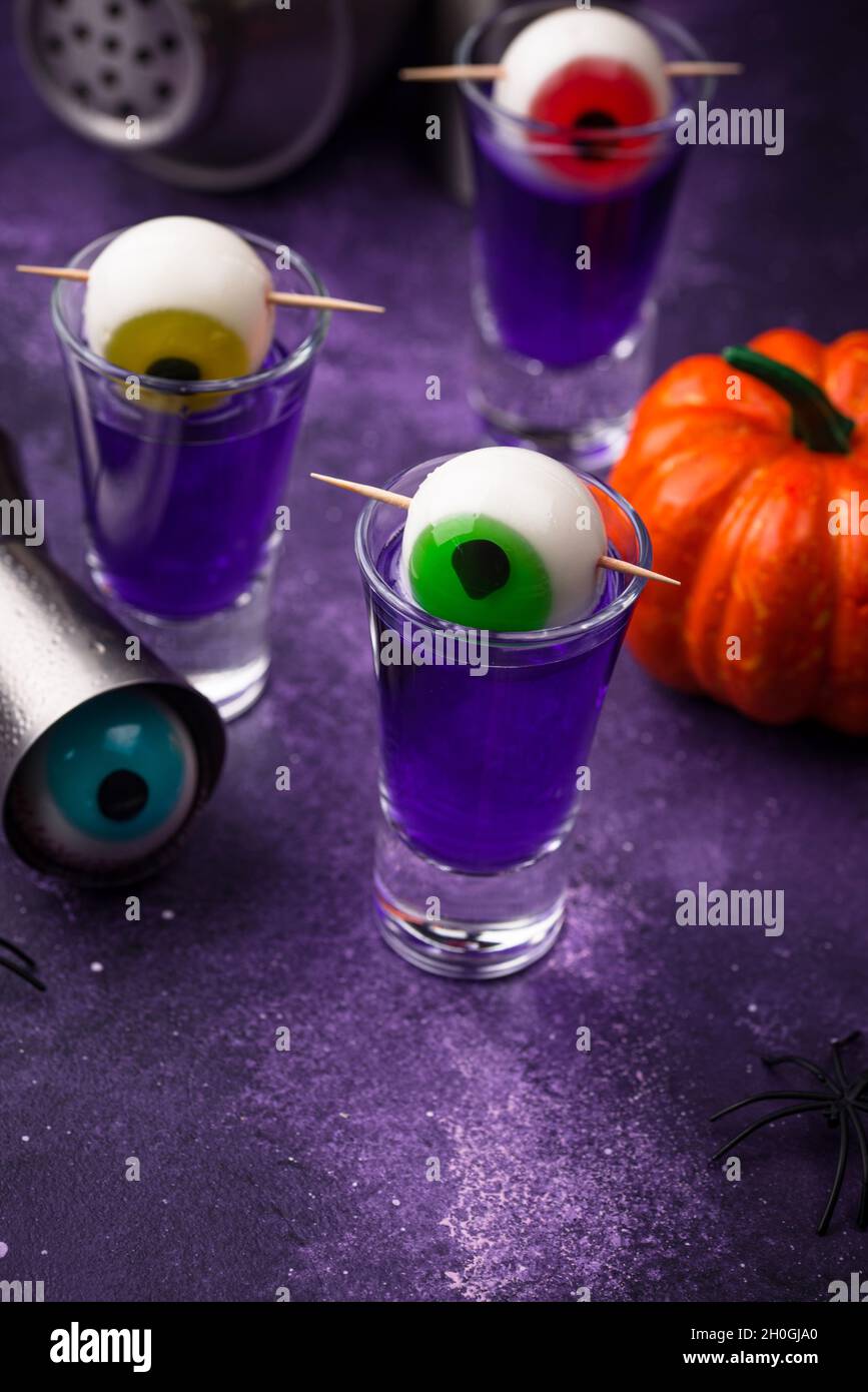 Halloween purple cocktail with eyes Stock Photo - Alamy