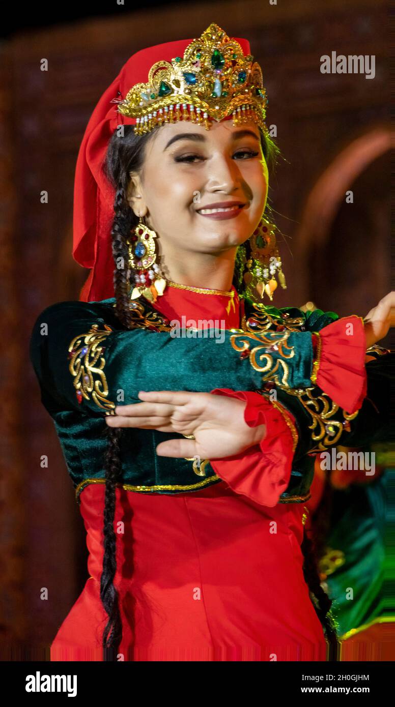 female dancer performing traditional dance for delegates of ...