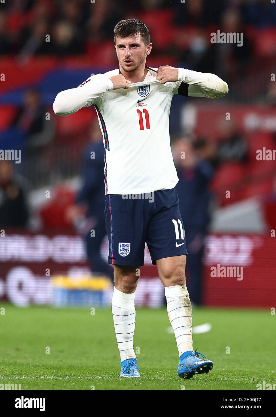 London, England, 12th October 2021. Mason Mount of England pulls at his ...