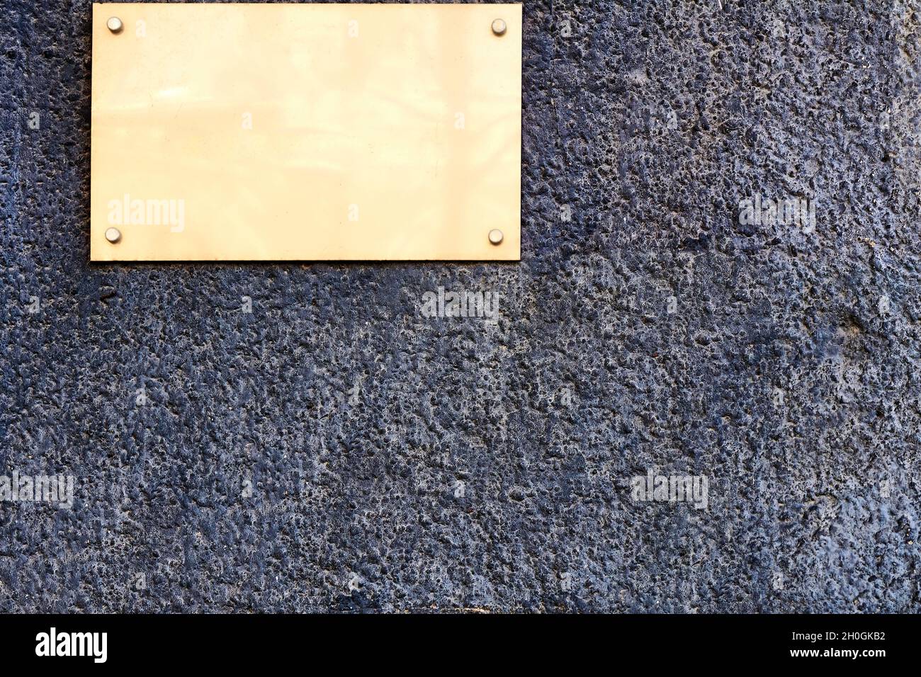Plaque with place for text on granite wall Stock Photo - Alamy
