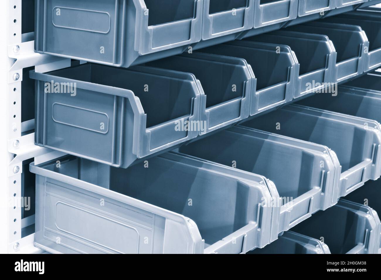 rows of multicolored plastic boxes for components Stock Photo - Alamy