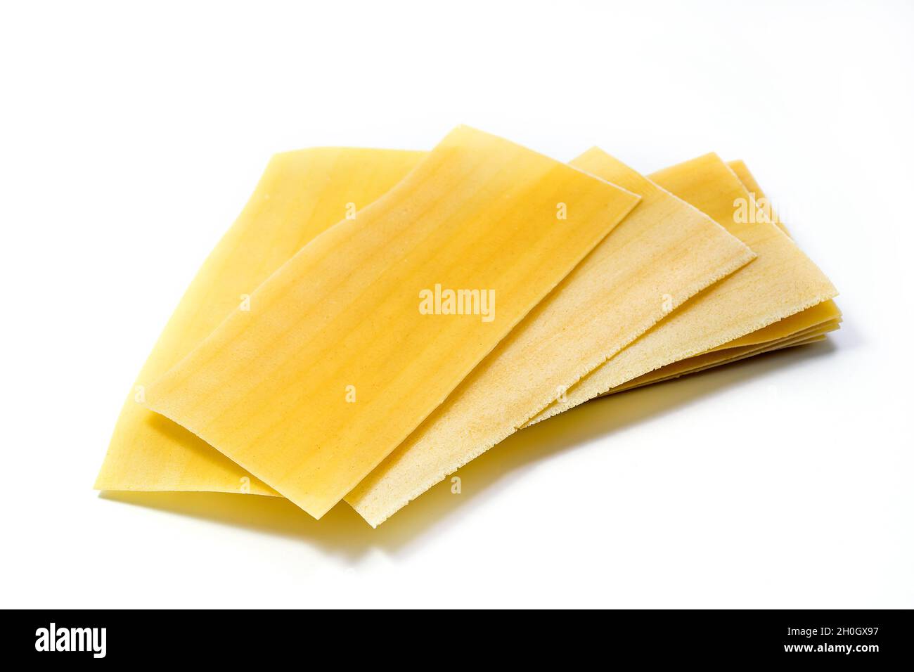 Uncooked raw lasagna pasta isolated on white background. Stack of dried ...