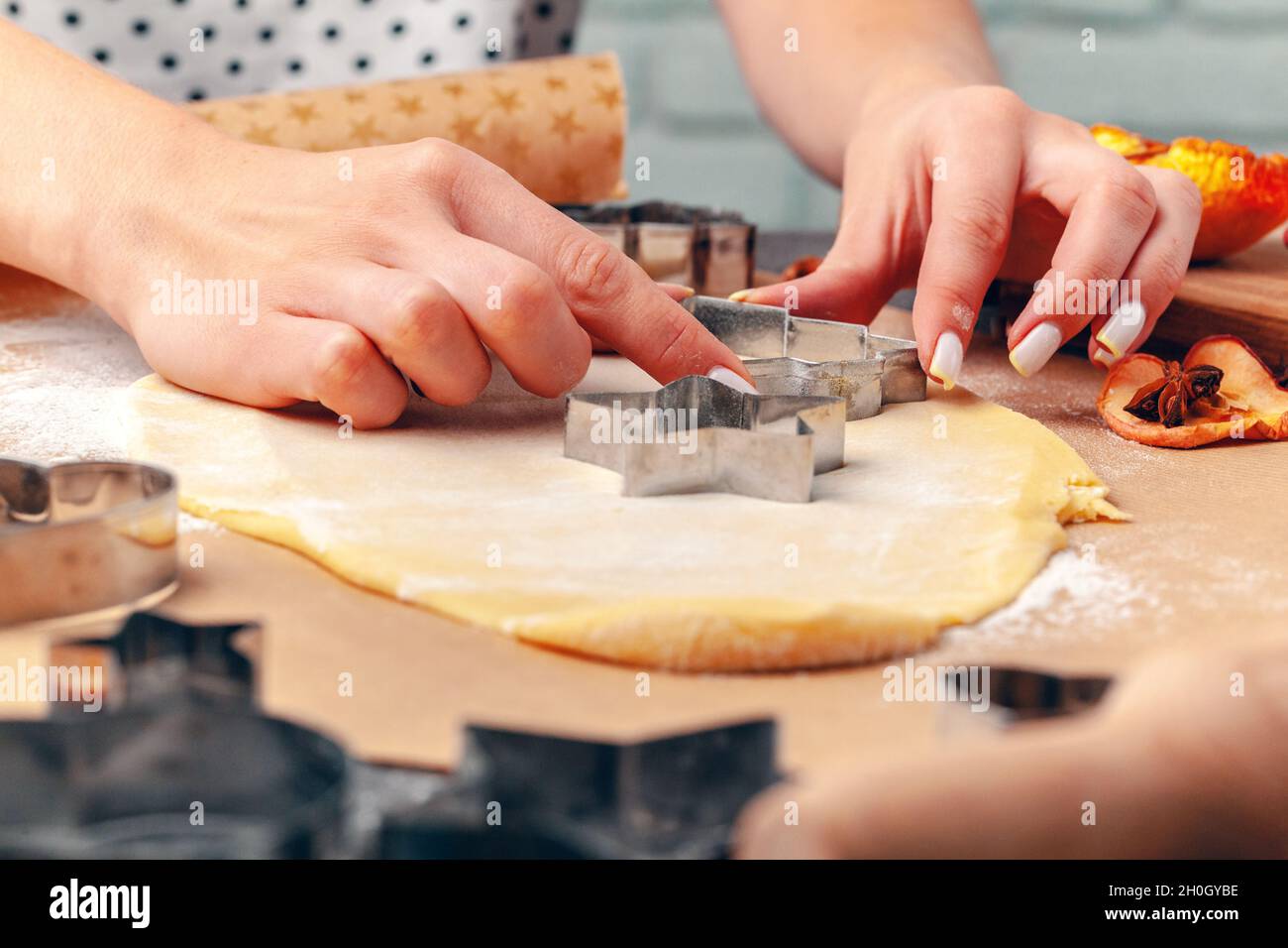 female hands making cookies from fresh dough at home Stock Photo - Alamy