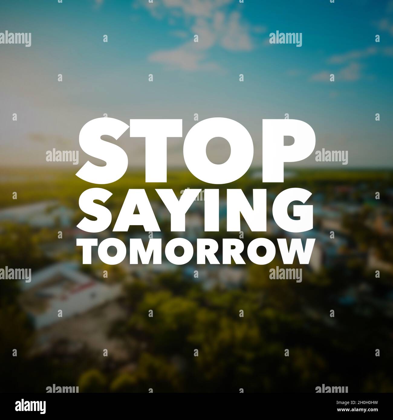 "Stop saying tomorrow" motivational text written on blurry background ...
