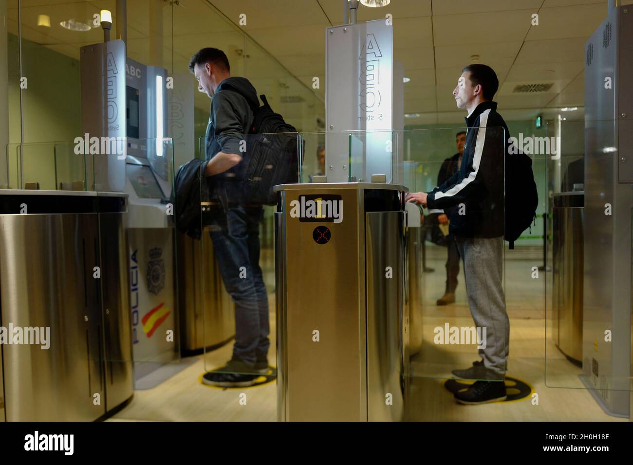 British nationals pass through passport control in Barcelona Airport ...