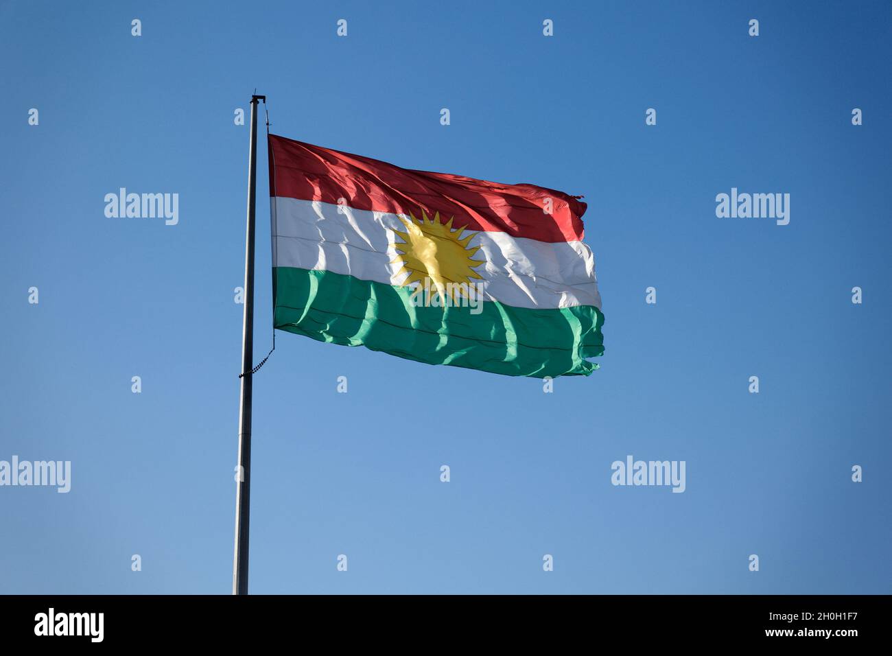 Erbil, Iraq. The flag of Kurdistan. Credit: MLBARIONA Stock Photo - Alamy