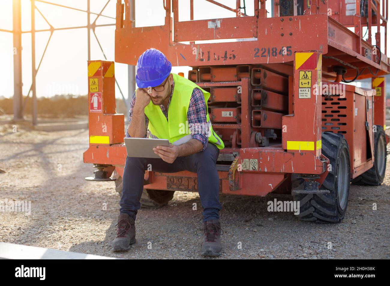 Man sitting on crane hi-res stock photography and images - Alamy