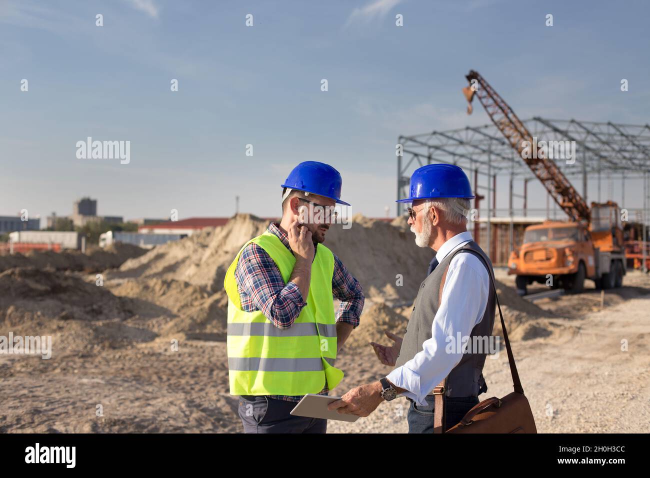 Two engineers looking at computer hi-res stock photography and images ...