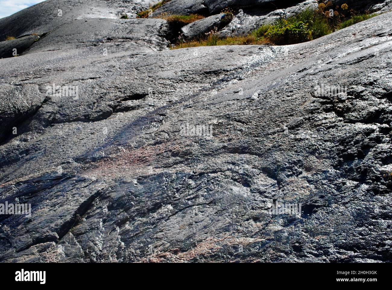 Glittering rocks and cliffs after rain on island in Fjällbacka ...