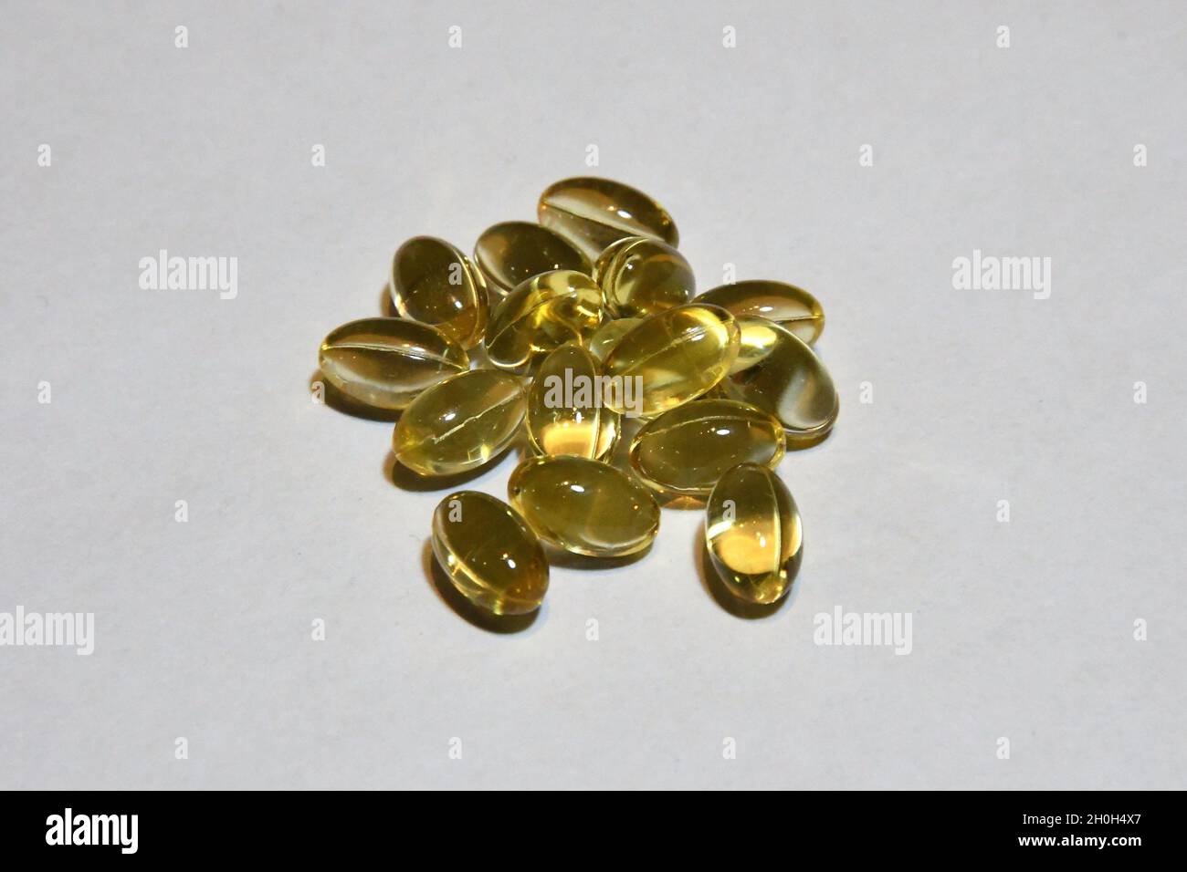 Vitamin pills in tablet or capsule form isolated on a white background ...