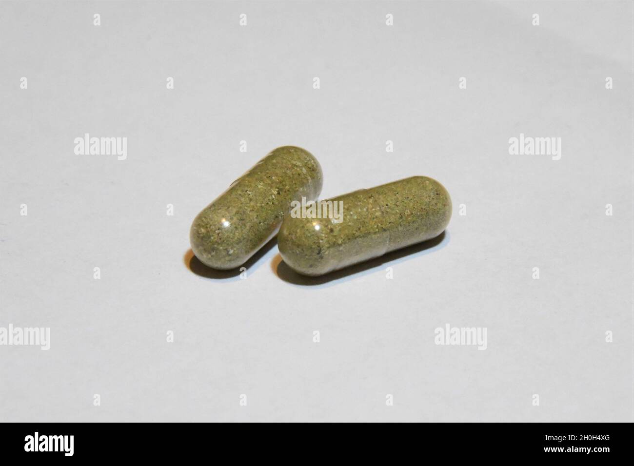 Vitamin pills in tablet or capsule form isolated on a white background ...