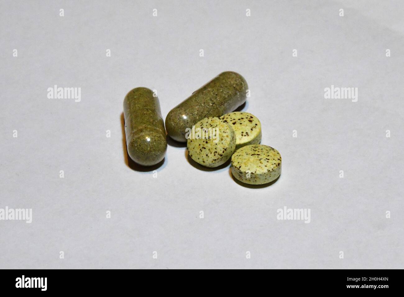 Vitamin pills in tablet or capsule form isolated on a white background ...