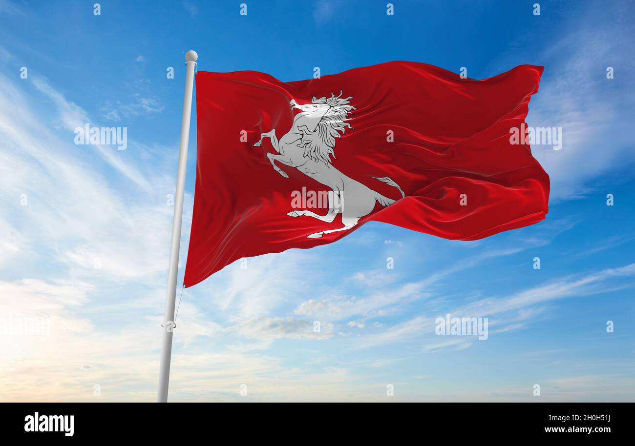 flag of county Kent, UK at cloudy sky background on sunset, panoramic ...