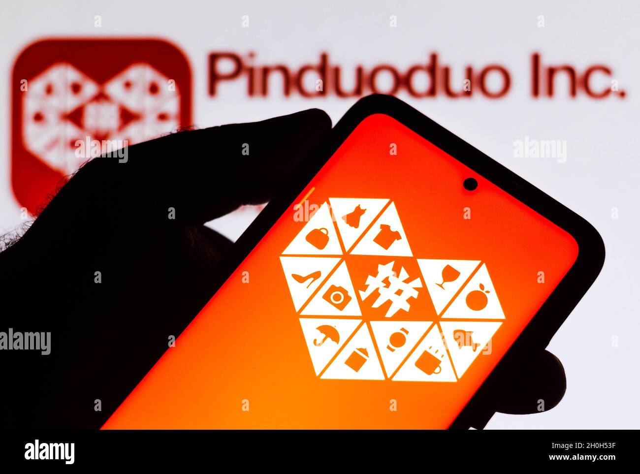 In this photo illustration the Pinduoduo logo seen displayed on a ...