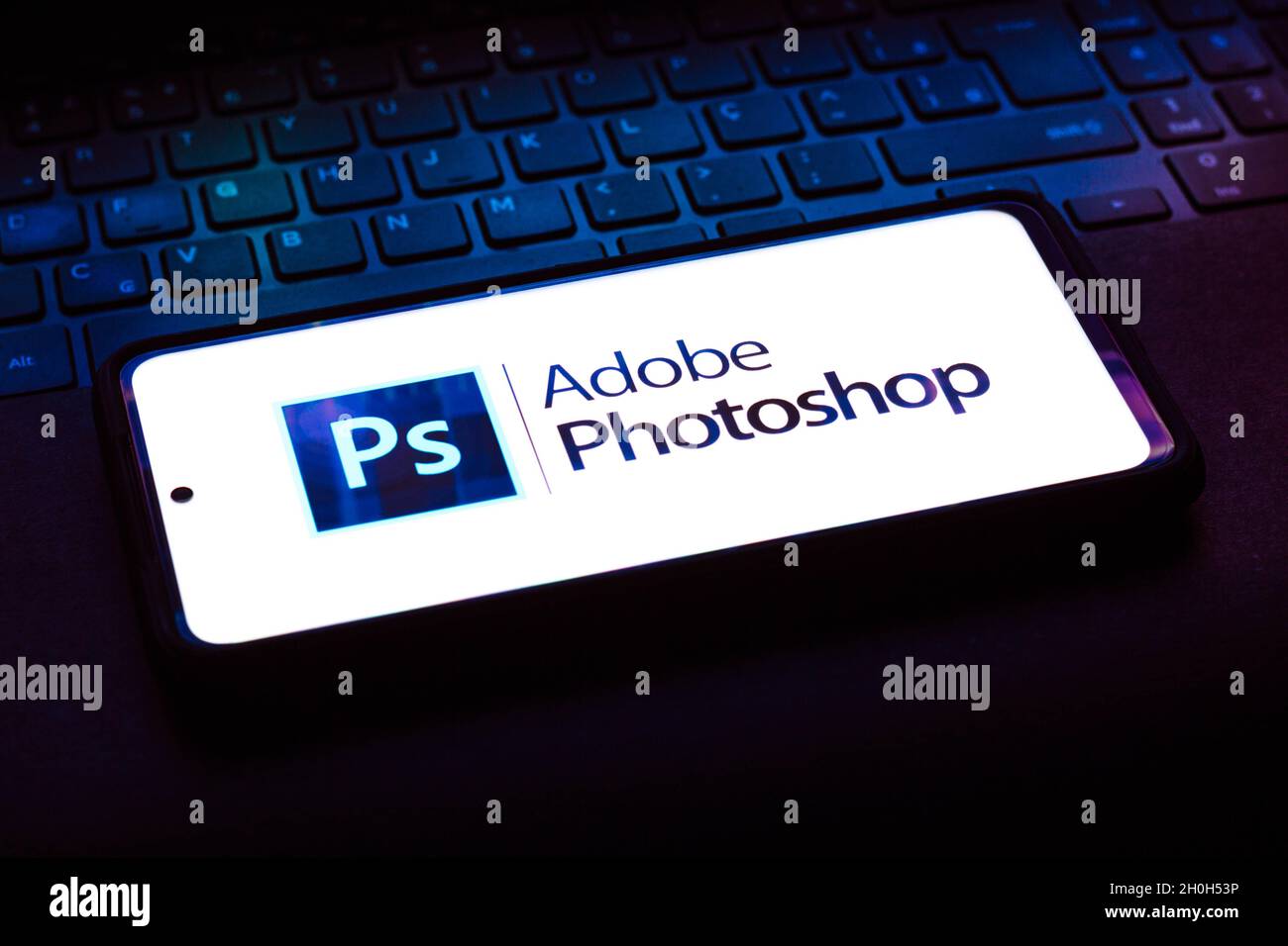 In this photo illustration the Adobe Photoshop logo seen displayed on a ...