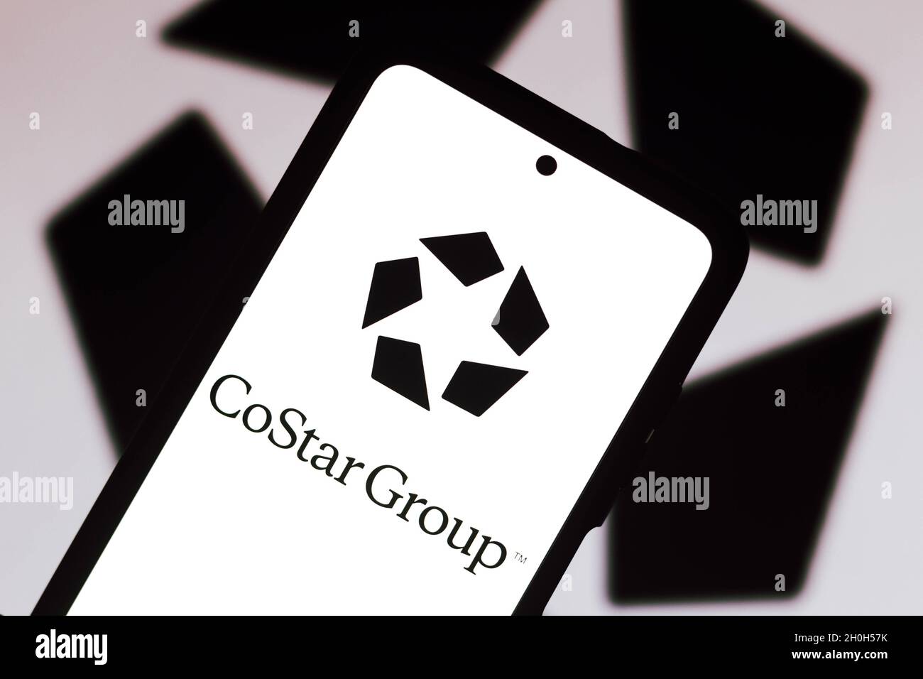 In this photo illustration the CoStar Group logo seen displayed on a ...
