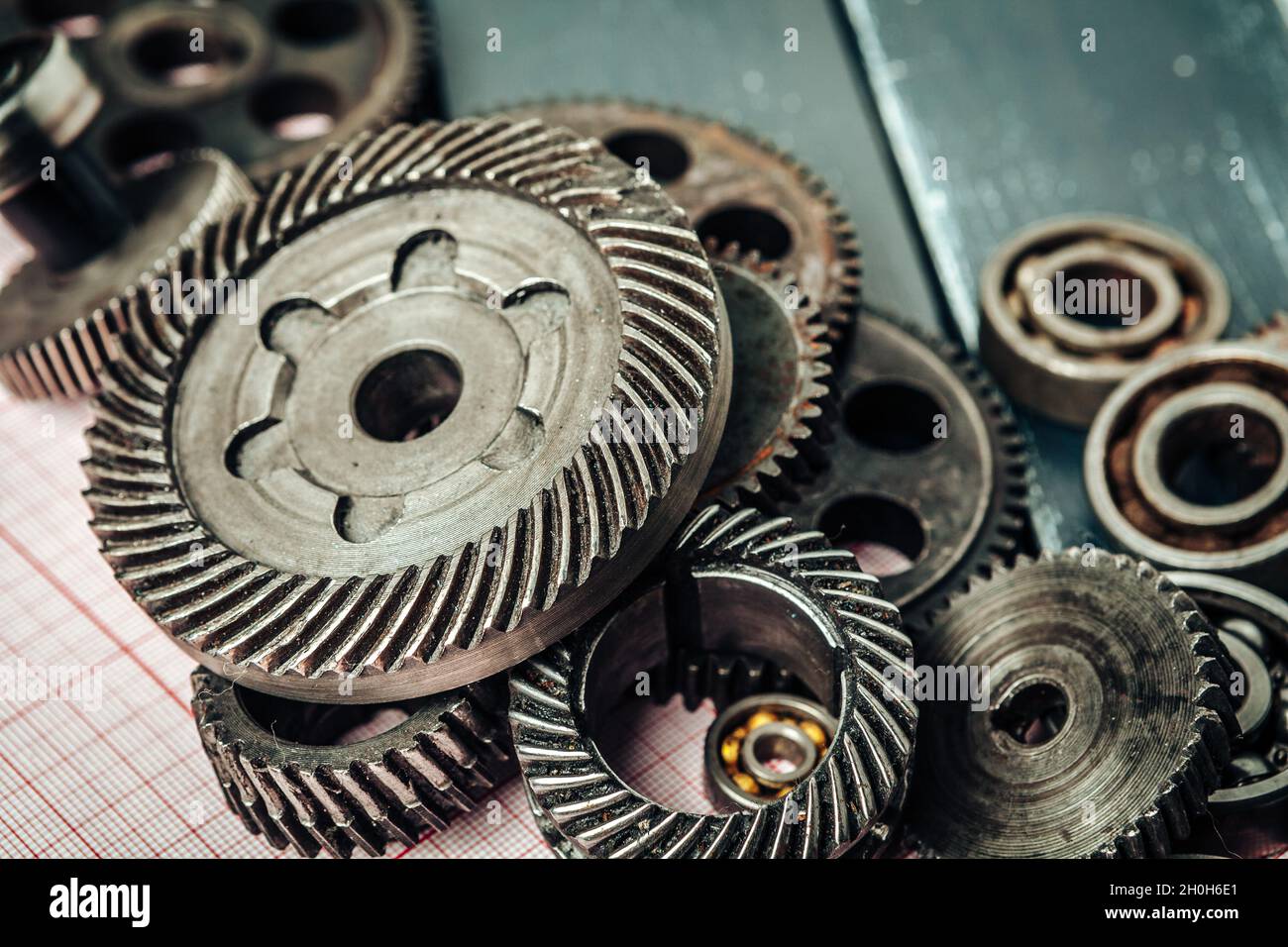 Car parts on graph paper close up. Engineering concept Stock Photo - Alamy