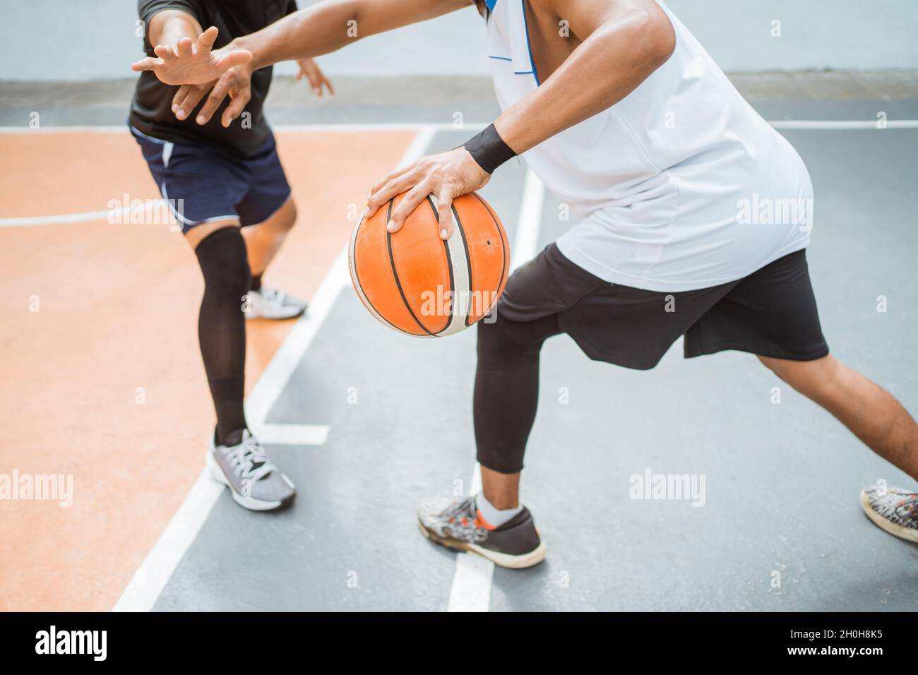 Basketball player's hand carrying a ball with a high dribbling ...