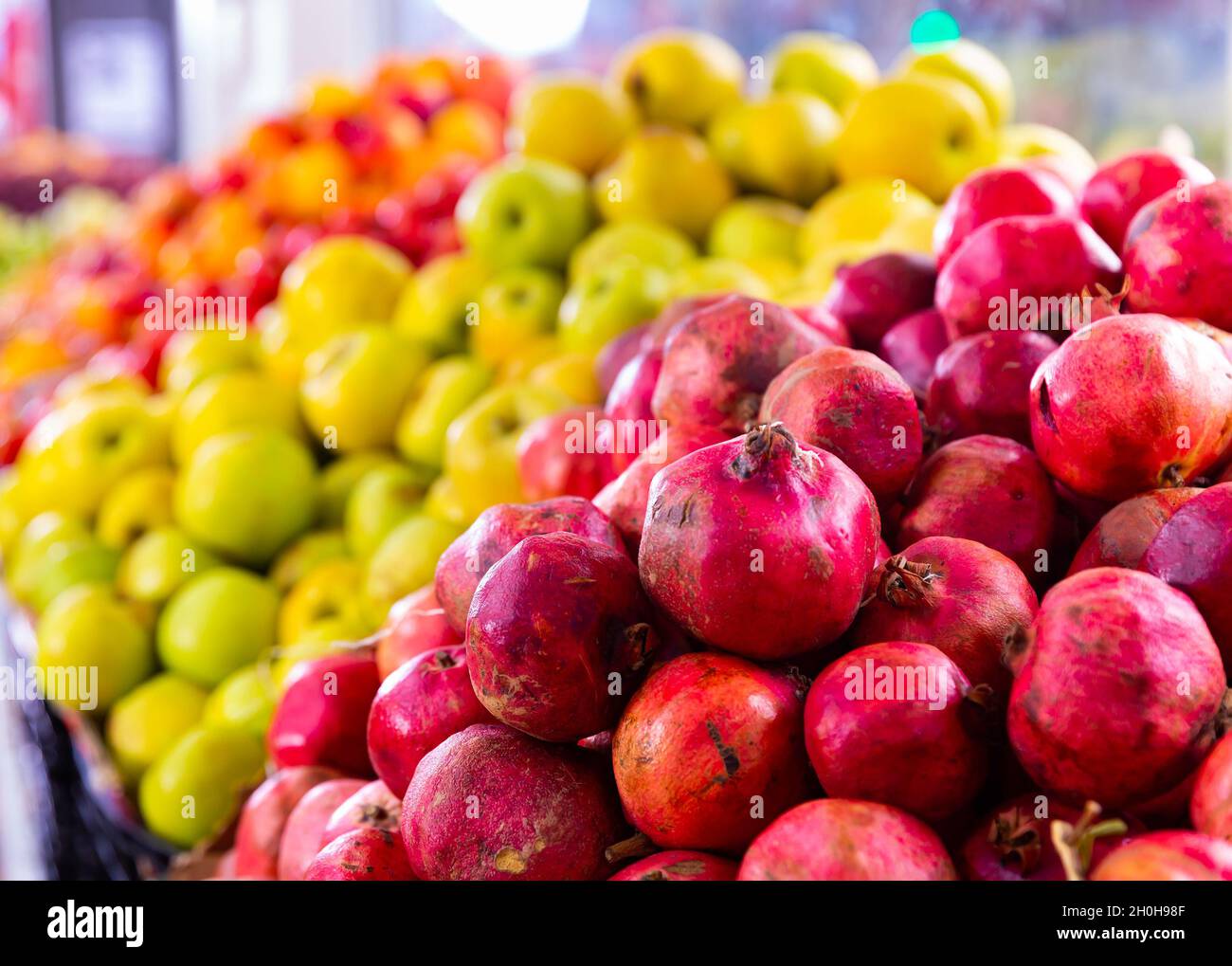 Fresh ripe pomegranates in box for sale Stock Photo - Alamy