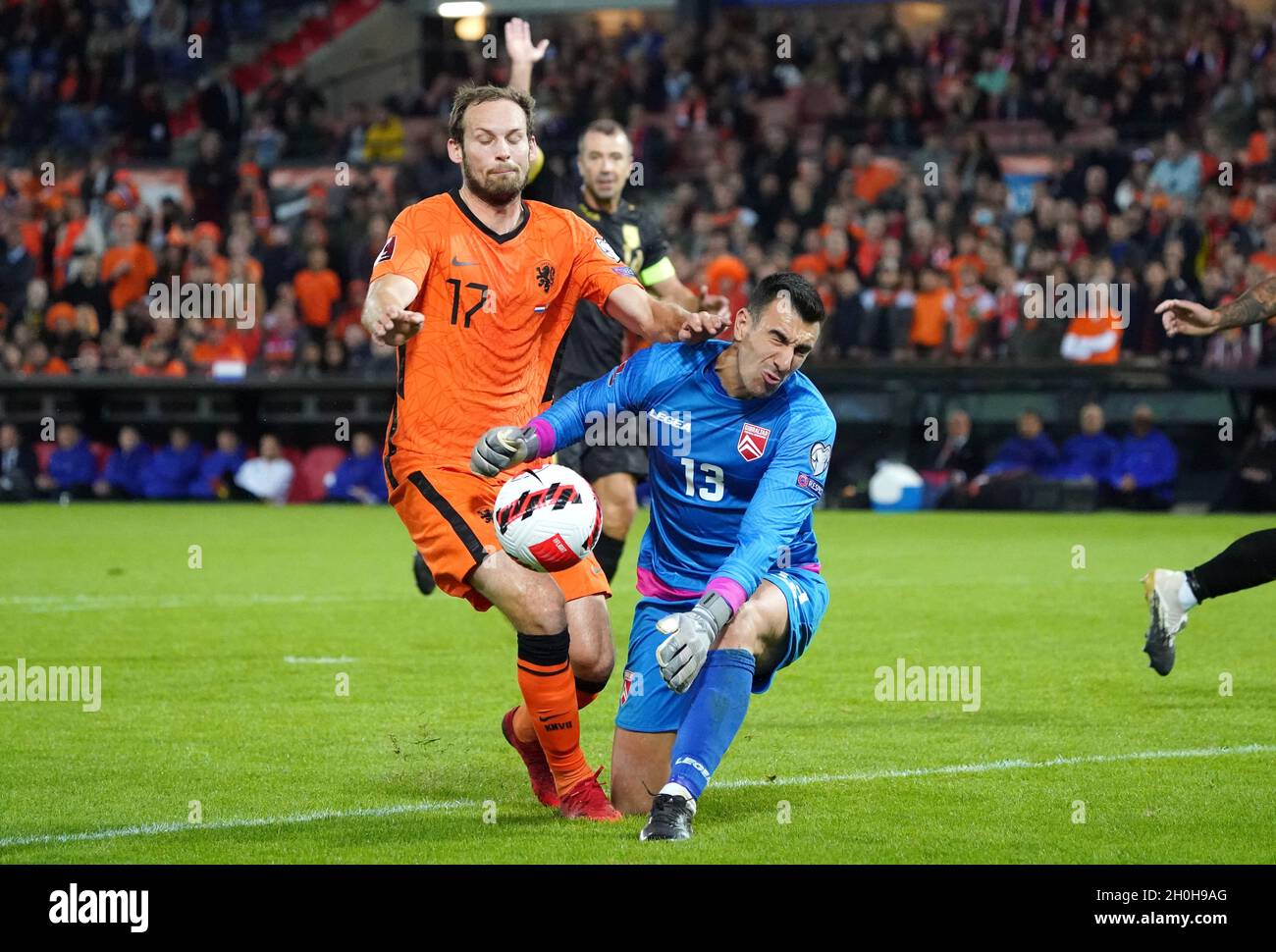 Daley Blind of the Netherlands (l) and goalkeeper Bradley Banda of ...