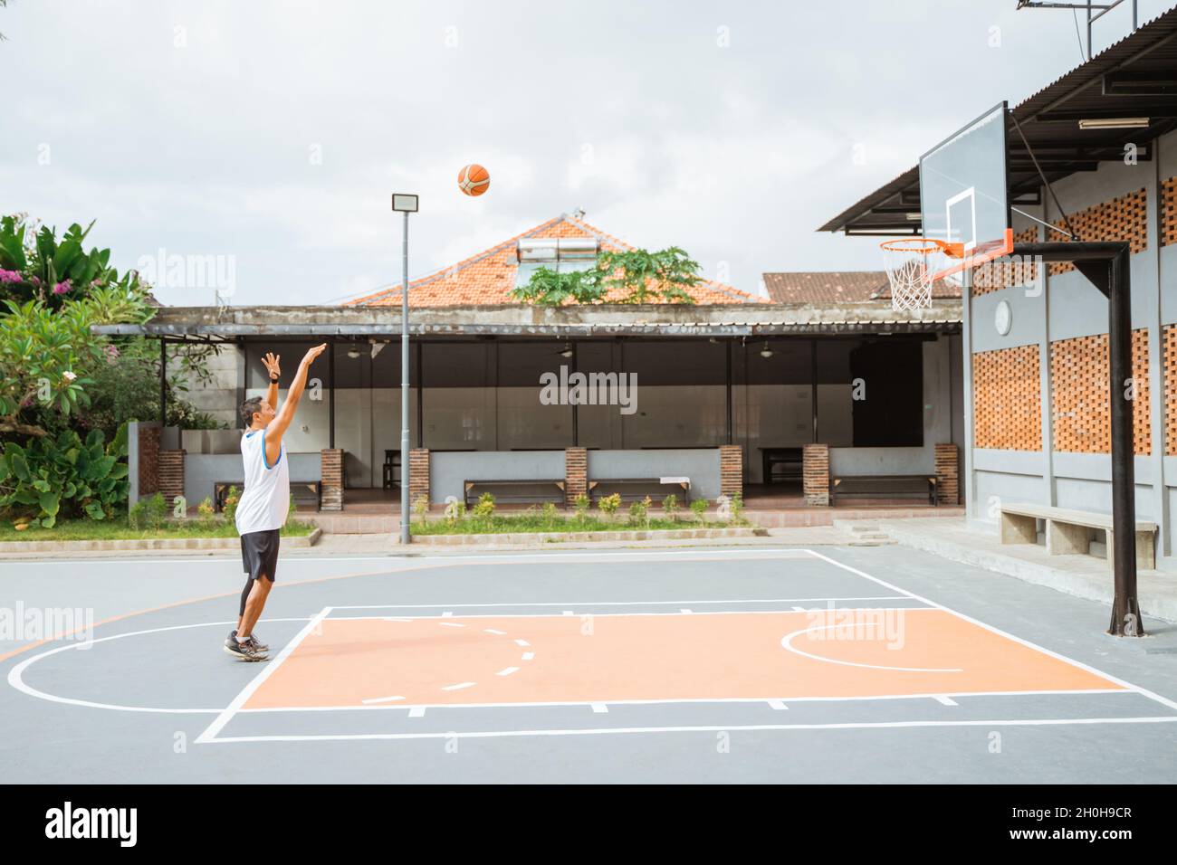 basketball player shoots a free throw into the hoop while practicing ...