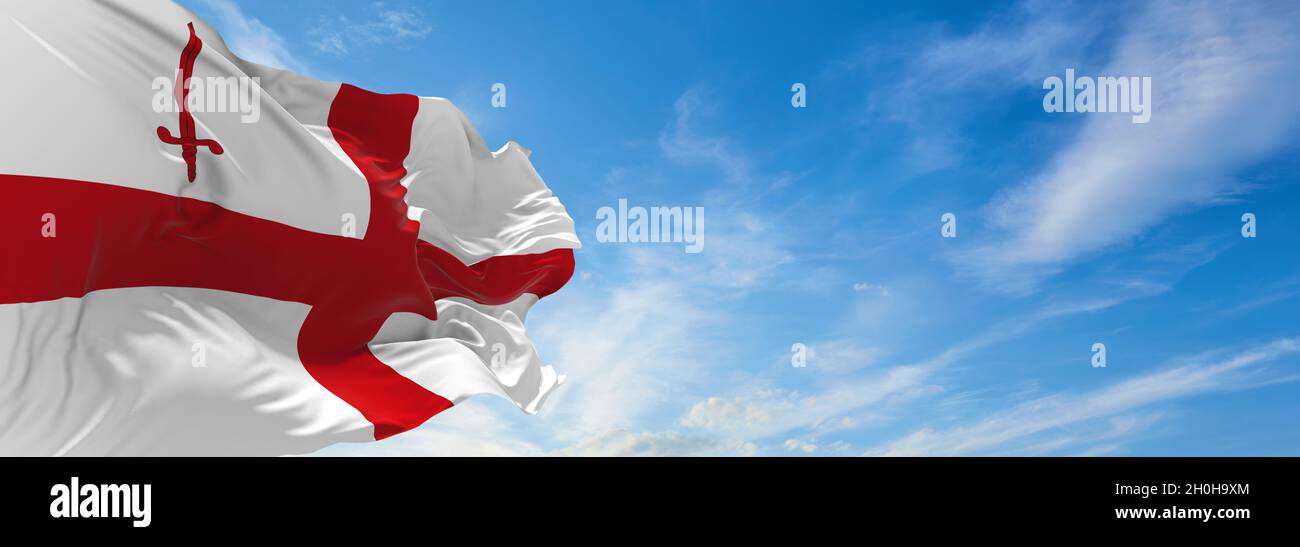 flag of the City of London at cloudy sky background on sunset ...