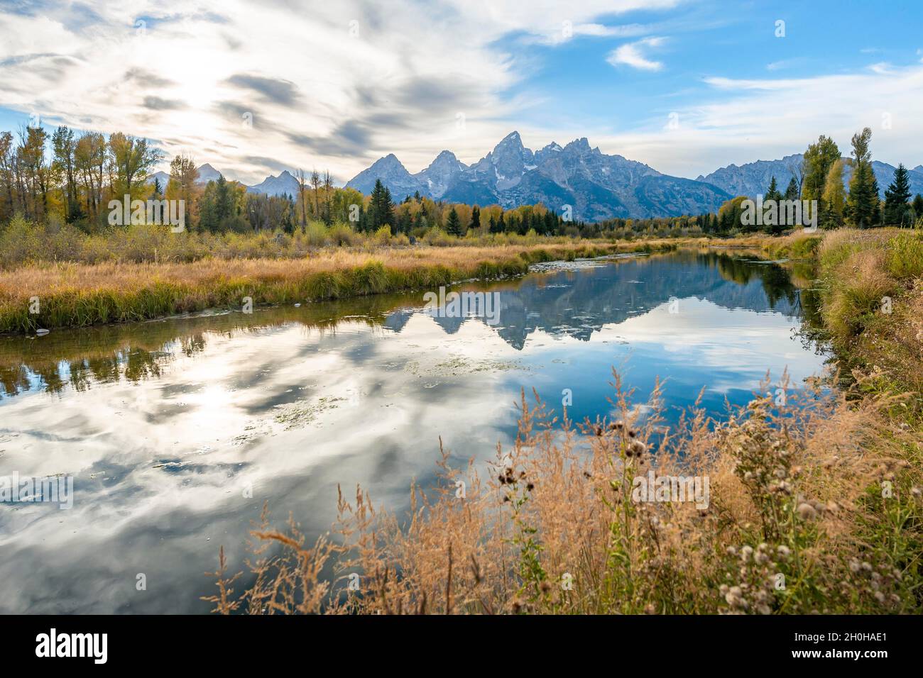 Grand Teton Range mountain range, reflection in river, autumn ...