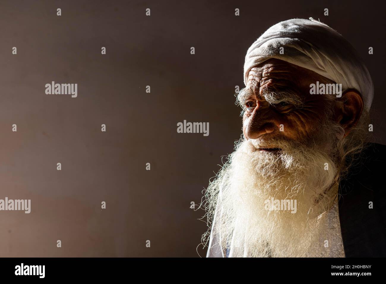 Sufi priest studying the holy Quran in the Shrine of Mawlana Abdur ...