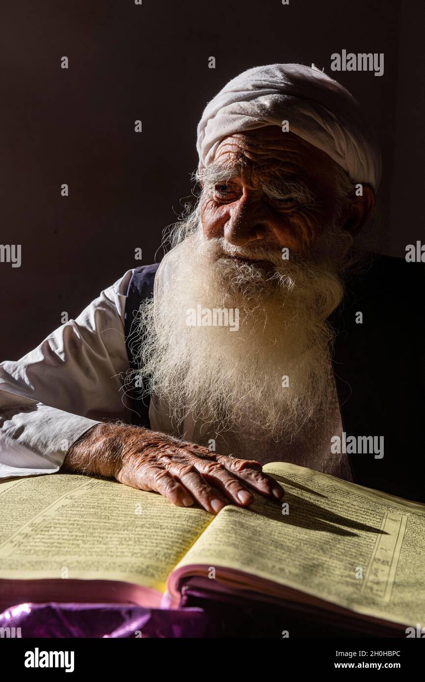 Sufi priest studying the holy Quran in the Shrine of Mawlana Abdur ...