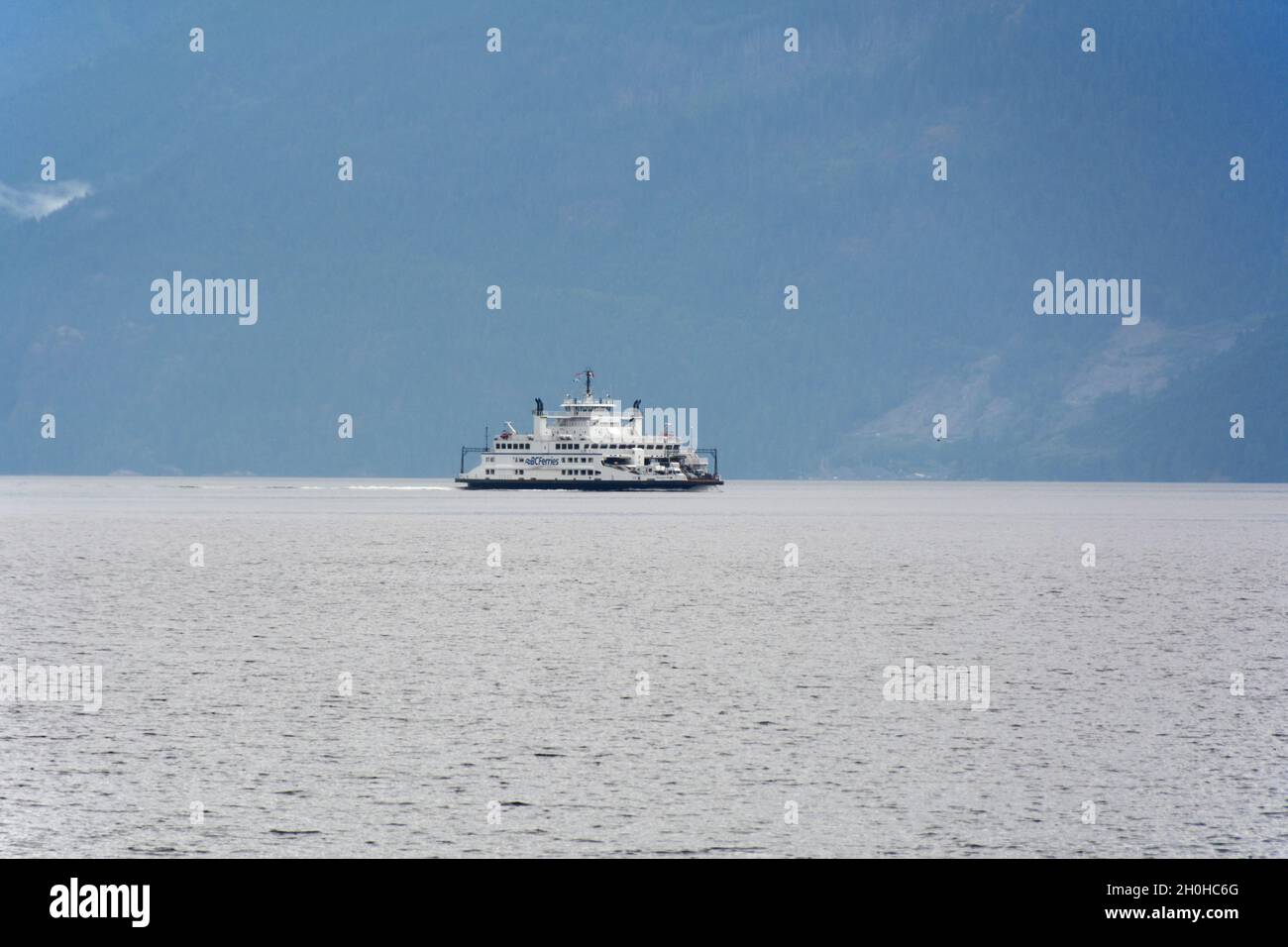 A BC car and passenger ferry sailing between terminals in Jervis Inlet ...