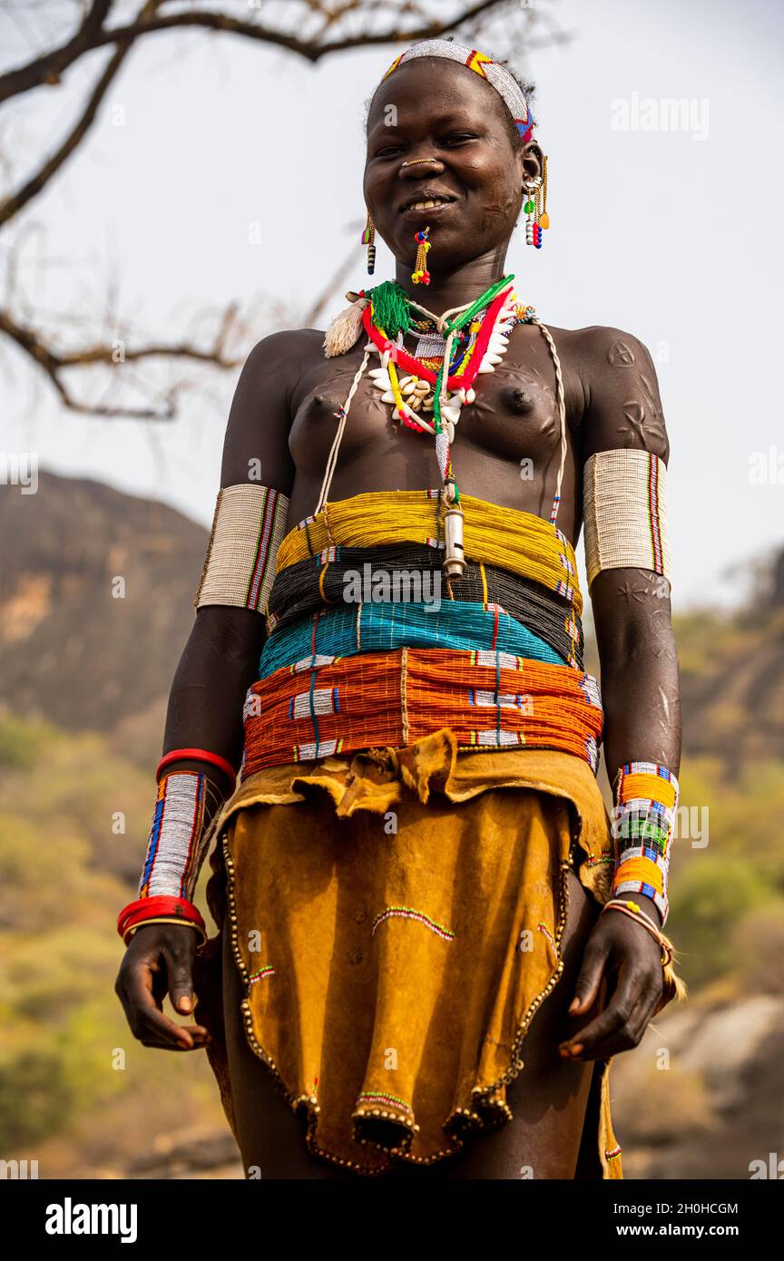 Traditional dressed young girl from the Laarim tribe, Boya hills ...