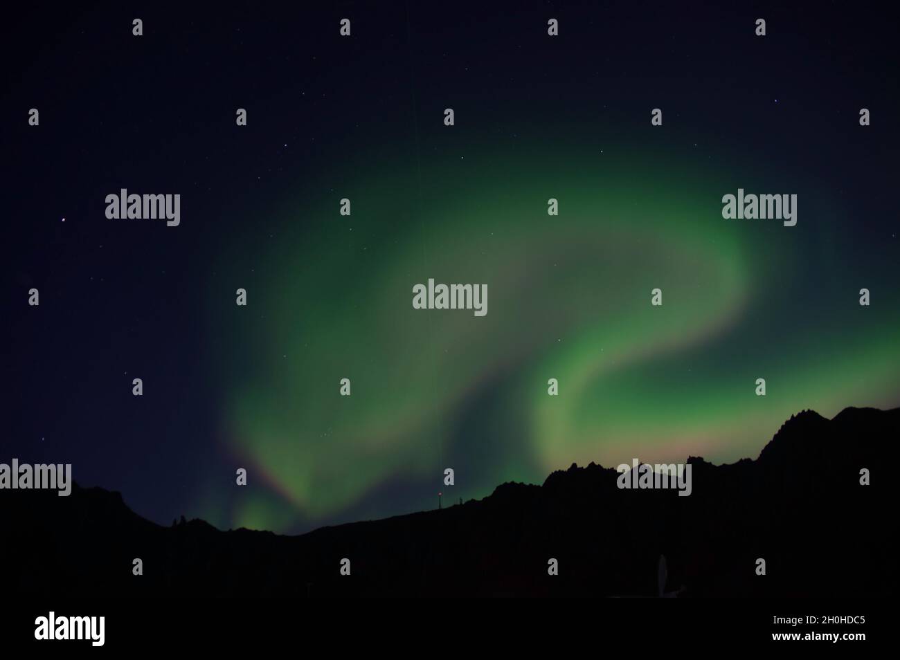 Northern lights (aurora borealis) over a mountain range, Laser, Andoya ...