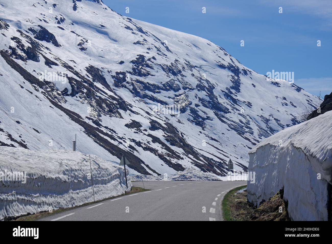 Snow walls along a road, late winter mountain landscape, Gaularfjellet ...