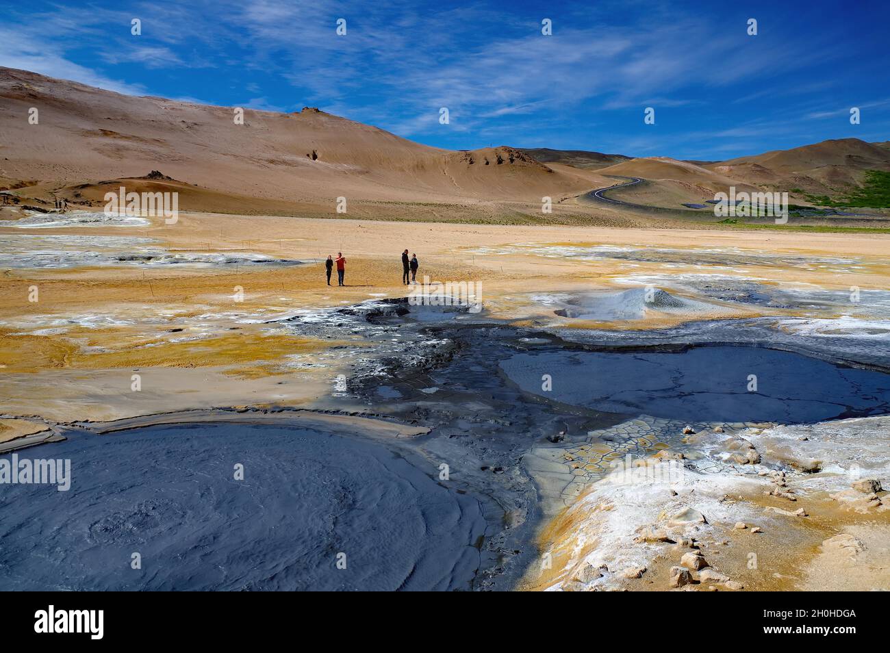 Hot mud springs bubbling in geothermal landscape with different colours ...