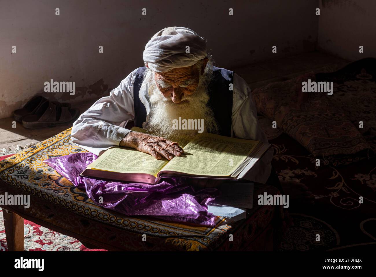 Sufi priest studying the holy Quran in the Shrine of Mawlana Abdur ...