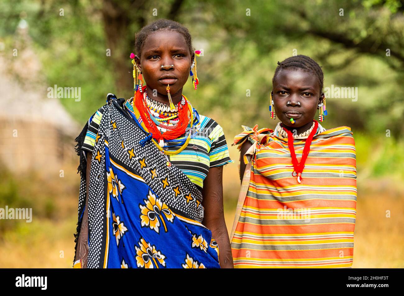 Traditional dressed young girls from the Laarim tribe, Boya hills ...