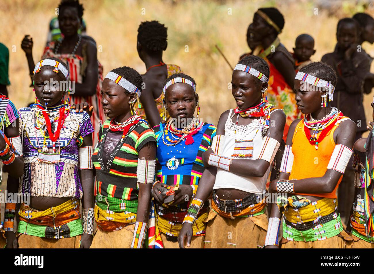 Traditional dressed young girls practising local dances, Laarim tribe ...
