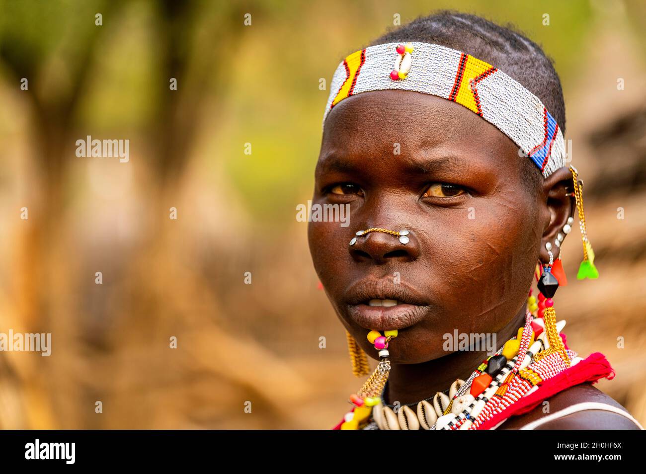 Traditional dressed young girl from the Laarim tribe, Boya hills ...