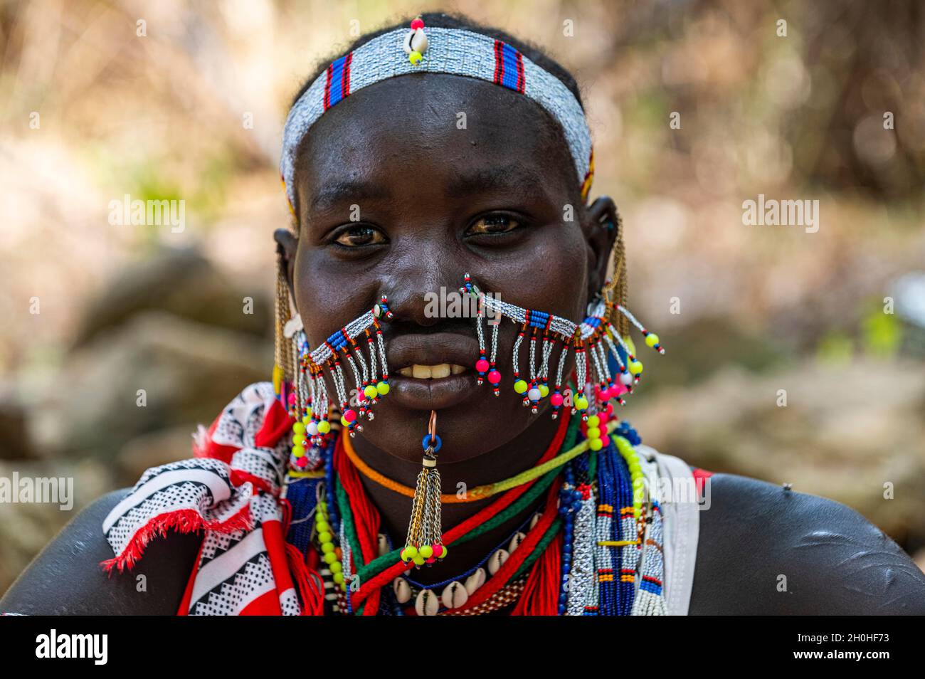 Traditional dressed young girl from the Laarim tribe, Boya hills ...