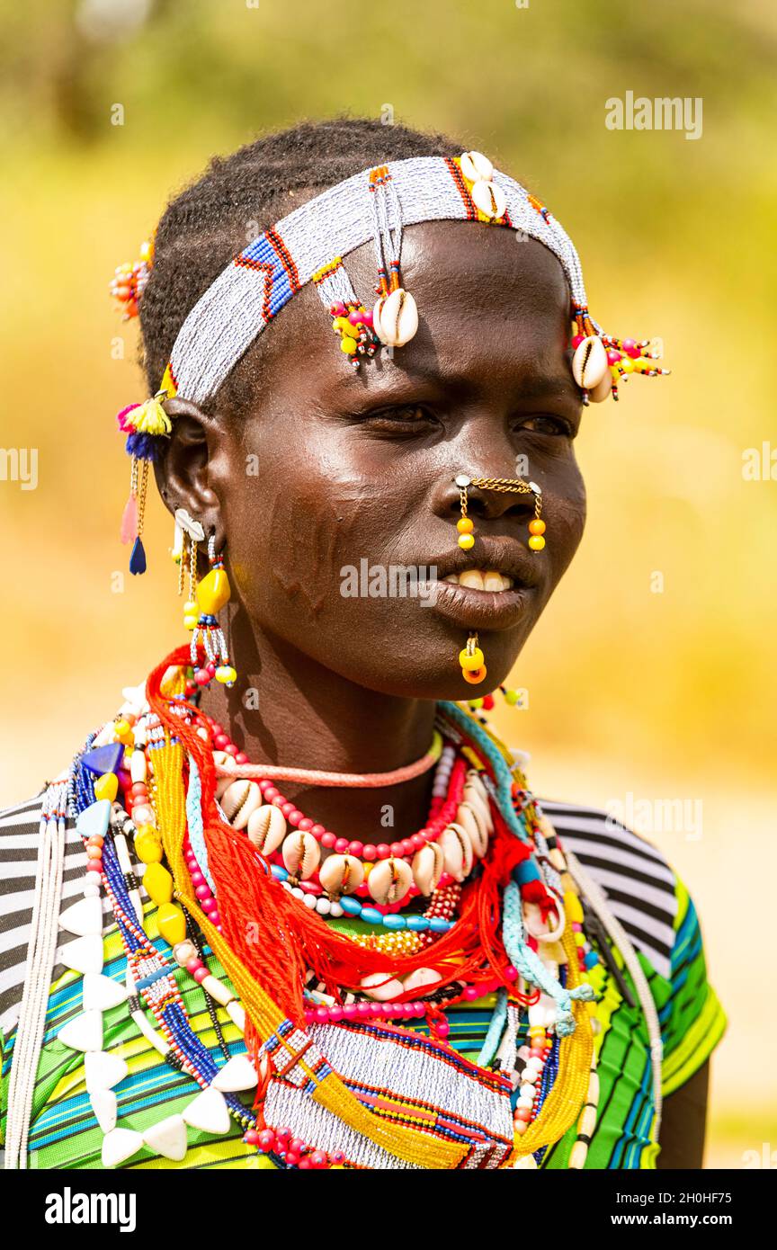 Traditional dressed young girl from the Laarim tribe, Boya hills ...