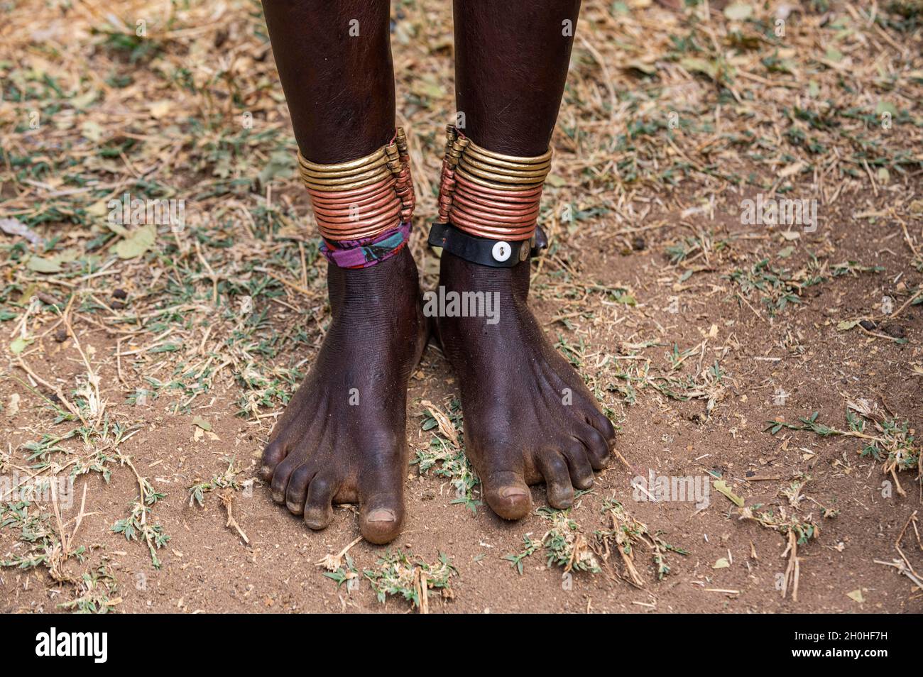 Close up from foot rings on the legs from a girl of the Laarim tribe ...