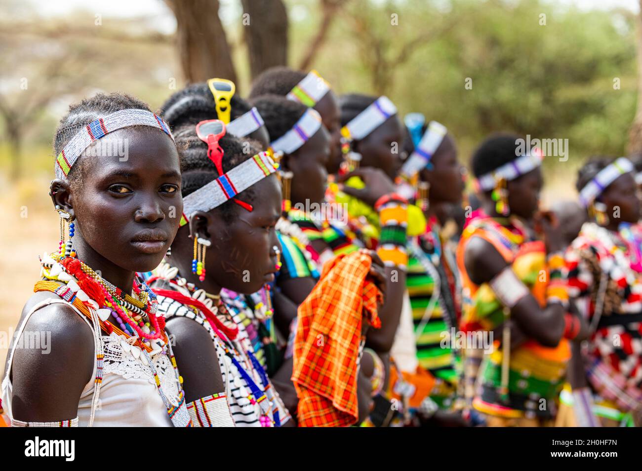 Traditional dressed young girls practising local dances, Laarim tribe ...