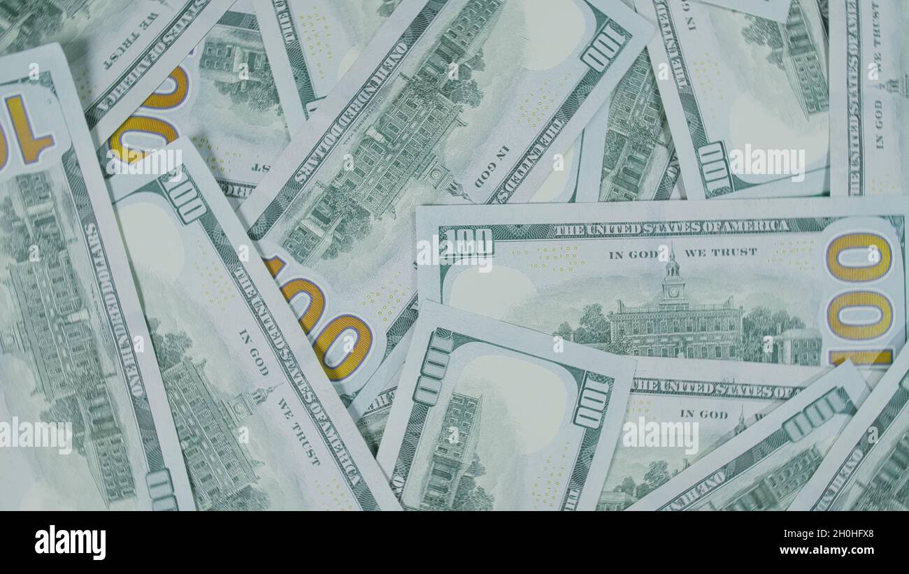 Many dollar are arranged around the edges of the image as a frame ...