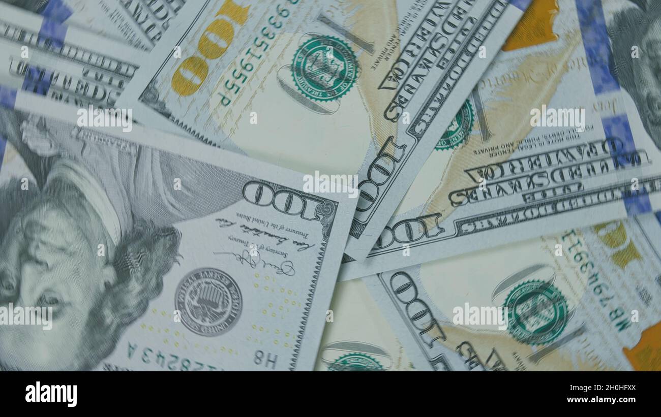 Many dollar are arranged around the edges of the image as a frame ...