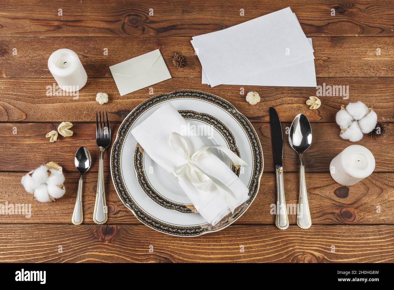 Beautiful table setting on wooden table from above Stock Photo - Alamy