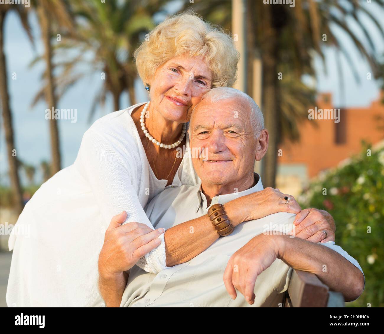 smiling male and female hugging Stock Photo - Alamy