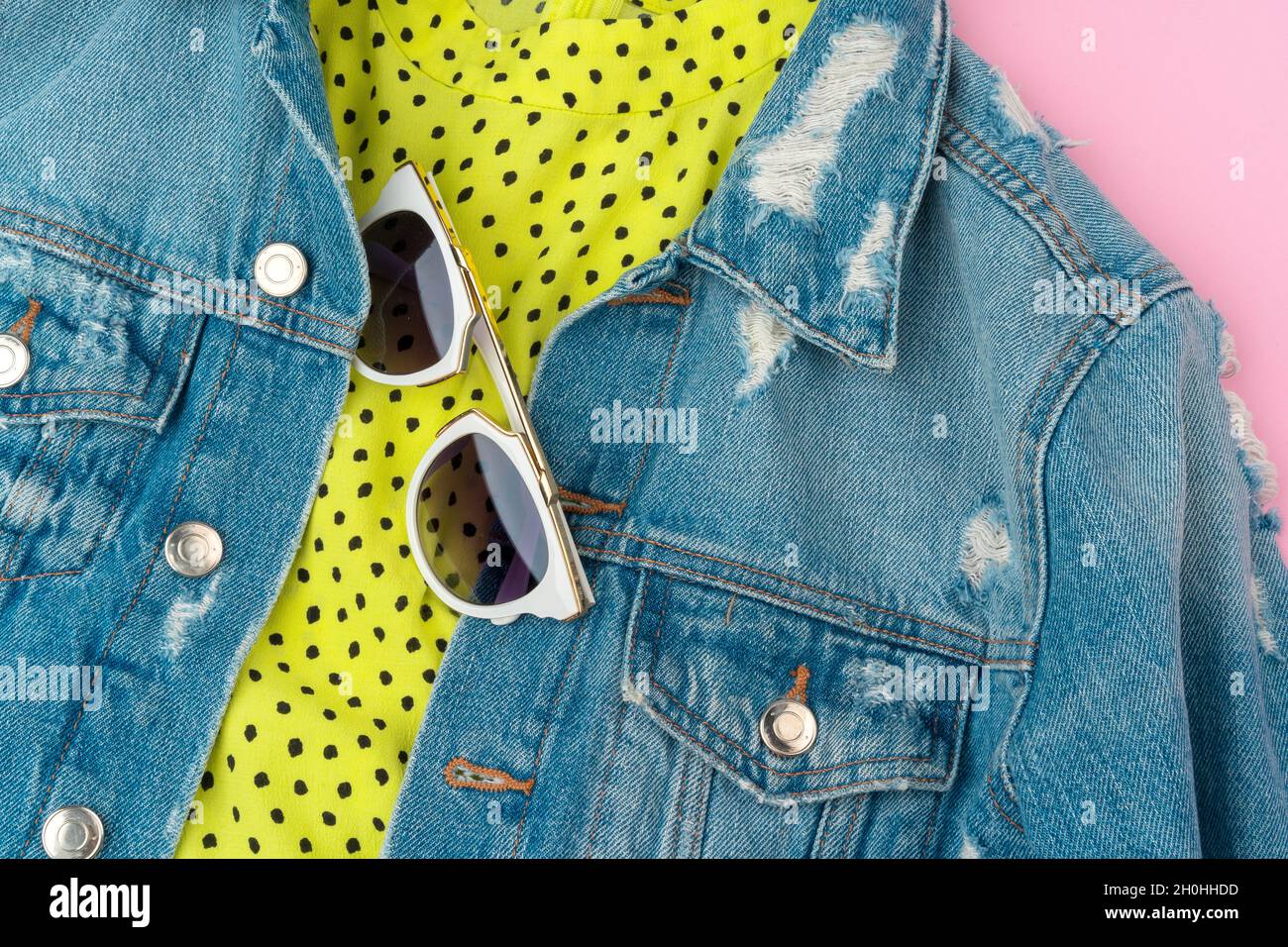 Stylish summer outfit for woman on pastel pink background Stock Photo ...